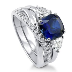 berricle sterling silver 3-stone wedding engagement rings simulated blue sapphire cushion cut cubic zirconia cz criss cross ring set for women, rhodium plated size 7