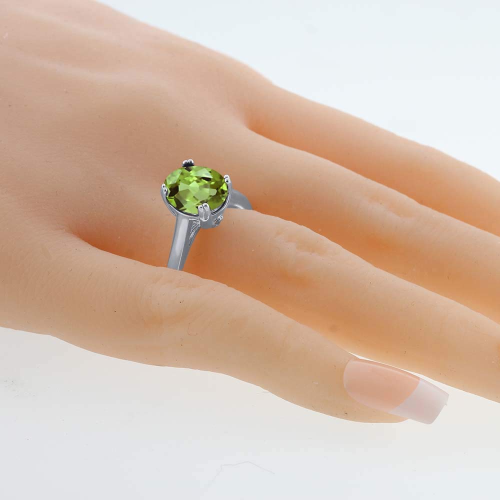 Gem Stone King 925 Sterling Silver Green Peridot and White Diamond Solitaire Ring For Women (3.03 Cttw, Oval 11X9MM, Gemstone Birthstone, Available In Size 5, 6, 7, 8, 9)