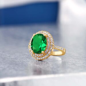 Gem Stone King 18K Yellow Gold Plated Silver Green Simulated Emerald Ring For Women (2.80 Cttw, Oval 9X7MM, Available in size 5, 6, 7, 8, 9)