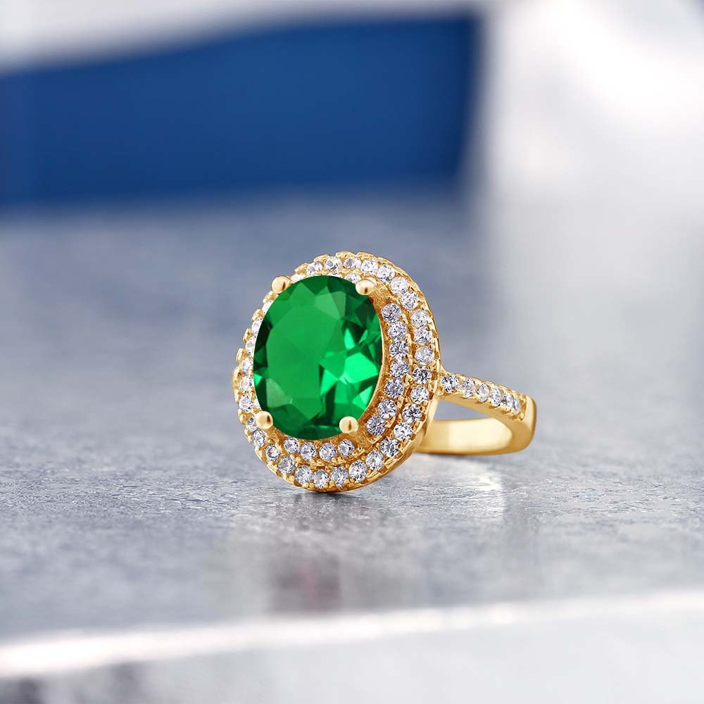 Gem Stone King 18K Yellow Gold Plated Silver Green Simulated Emerald Ring For Women (2.80 Cttw, Oval 9X7MM, Available in size 5, 6, 7, 8, 9)