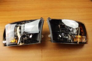 mopar dodge ram 1500 2500 3500 set of black bezel halogen headlights oem