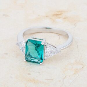 Rhodium Plated Classic Engagement Ring With 4.5ct Aqua Radiant Cut And Trillion Cut Cubic Zirconia Size 8