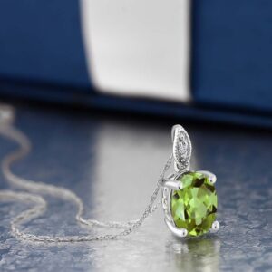 Gem Stone King 10K White Gold Green Peridot and Diamond Pendant Necklace For Women (1.80 Cttw, Gemstone Birthstone, Oval 9X7MM With 18 Inch Chain)