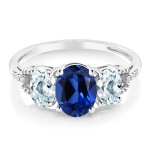 Gem Stone King 10K White Gold Blue Created Sapphire Sky Blue Aquamarine and Diamond Accent 3-Stone Engagement Ring | 2.51 Cttw | 3 Stone Wedding Anniversary Promise Ring For Women (Size 8)