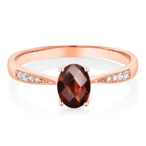 gem stone king 10k rose gold red garnet and white diamond engagement ring for women (0.86 cttw, gemstone january birthstone, oval checkerboard 7x5mm, available in size 5, 6, 7, 8, 9)