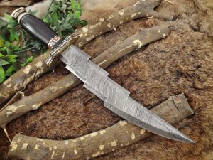 15 inches long damascus steel hunting knife, 10" long custom made hand forged damascus steel zig zag blade, bull horn with engraved brass scale and finger guard, cow hide leather sheath with belt loop