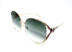 gucci gg0225s 003 gold/green gg0225s round sunglasses lens category 2 size 63