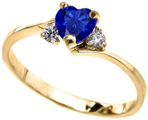 10k yellow gold heart cut lab grown blue sapphire & white cubic zirconia three stone bypass band september birthstone engagement ring - size 7