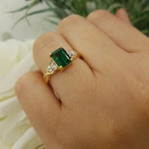 Dazzlingrock Collection 8x6mm Emerald Shape Center Lab Created Emerald & 2.2mm Round White Sapphire on Side Crisscross Shank Engagement Ring for Her in 18K Yellow Gold Size 7.5