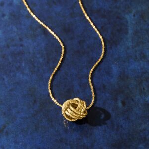 Ross-Simons Italian 14kt Yellow Gold Textured Love Knot Necklace. 18 inches