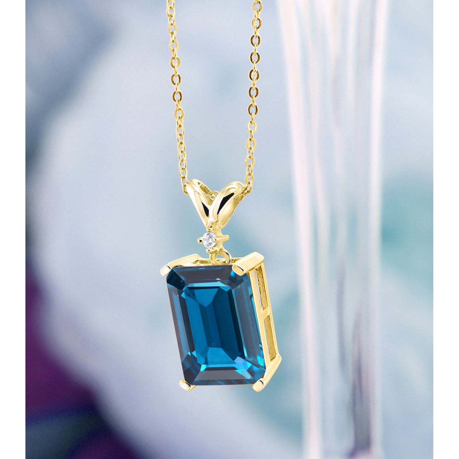 Gem Stone King 18K Yellow Gold Plated Silver London Blue Topaz and White Diamond Pendant Necklace For Women (9.52 Cttw, Gemstone Birthstone, with 18 Inch Chain)