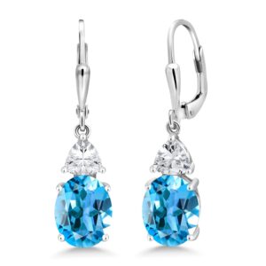 gem stone king 925 sterling silver swiss blue topaz dangle earrings for women | 5.40 cttw | gemstone november birthstone | oval 10x8mm | trillion 5mm