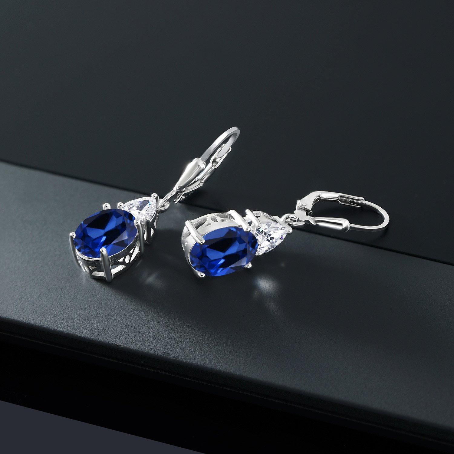 Gem Stone King 925 Sterling Silver Blue Created Sapphire Earrings | 6.60 Cttw | Oval 10X8MM | Trillion 5MM | Gemstone Birthstone | Drop Dangle Earrings For Women