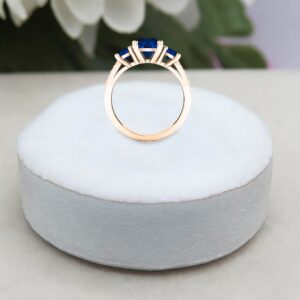 Dazzlingrock Collection 7 MM Centre & 4 MM Side Round Lab Created Blue Sapphire with Natural White Diamond Women Three Stone Engagement Ring | 14K Rose Gold, Size 7