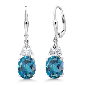 gem stone king 925 sterling silver london blue topaz and white zirconia dangle earrings for women (5.60 cttw, gemstone november birthstone, oval 10x8mm, trillion 5mm)