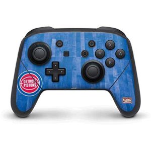 skinit decal gaming skin compatible with nintendo switch pro controller - officially licensed nba detroit pistons hardwood classics design