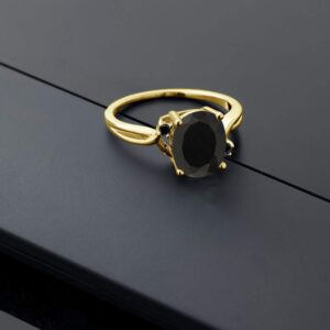 Gem Stone King 18K Yellow Gold Plated Silver Black Onyx and Black Diamond 3 Stone Ring For Women (2.53 Cttw, Oval 10X8MM, Gemstone December Birthstone, Available In Size 5, 6, 7, 8, 9)