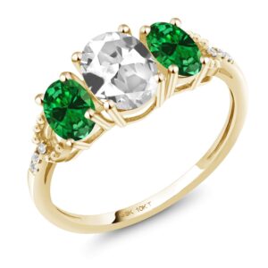 gem stone king 10k yellow gold oval white created sapphire green simulated emerald and diamond 3-stone engagement ring for women (1.72 cttw, available in size 5, 6, 7, 8, 9)