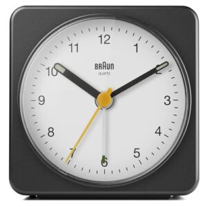 braun classic analogue alarm clock with snooze and light, quiet quartz sweeping movement, crescendo beep alarm in black and white, model bc03bw.