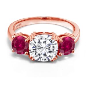 18K Rose Gold Plated Silver Forever Classic Moissanite From Charles & Colvard and Red Created Ruby 3 Stone Engagement Ring For Women (3.70 Cttw, Gemstone, Cushion 8MM, Size 5)