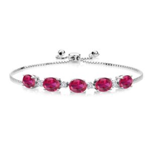 gem stone king 925 sterling silver red created ruby and white lab grown diamond tennis bracelet for women (7.76 cttw, oval center stone:8x6mm, small stones: 2.5mm)