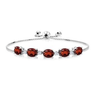 gem stone king 925 sterling silver red garnet and white created sapphire tennis bracelet for women (7.70 cttw, oval 8x6mm, gemstone birthstone, fully adjustable up to 9 inch))