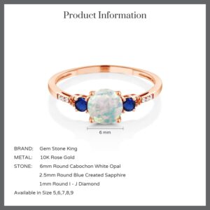 Gem Stone King 10K Rose Gold White Simulated Opal Blue Created Sapphire and White Diamond Accent 3-Stone Engagement Ring For Women (0.95 Cttw, Round Cabochon 6MM, Gemstone October Birthstone, Size 9)