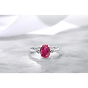 Gem Stone King 10K White Gold Oval Red Created Ruby and White Diamond Engagement Ring For Women (1.63 Cttw, Available In Size 5, 6, 7, 8, 9)