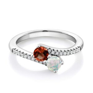 gem stone king 925 sterling silver red garnet and white opal bypass ring for women (0.86 cttw, gemstone january birthstone, round 4mm, available in size 5, 6, 7, 8, 9)