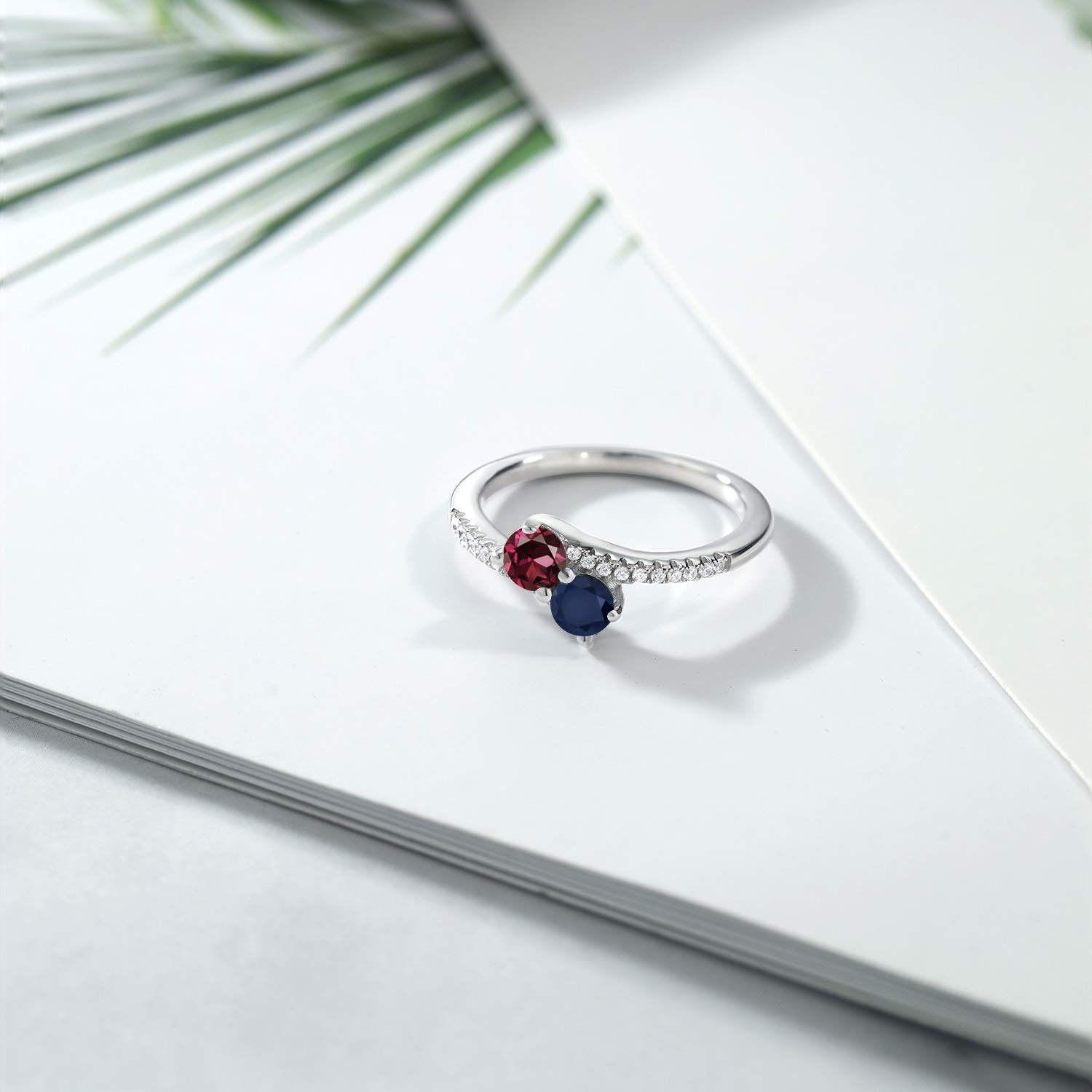 Gem Stone King 925 Sterling Silver Red Rhodolite Garnet and Blue Sapphire Bypass Ring For Women (0.96 Cttw, Gemstone January Birthstone, Round 4MM, Available In Size 5, 6, 7, 8, 9)