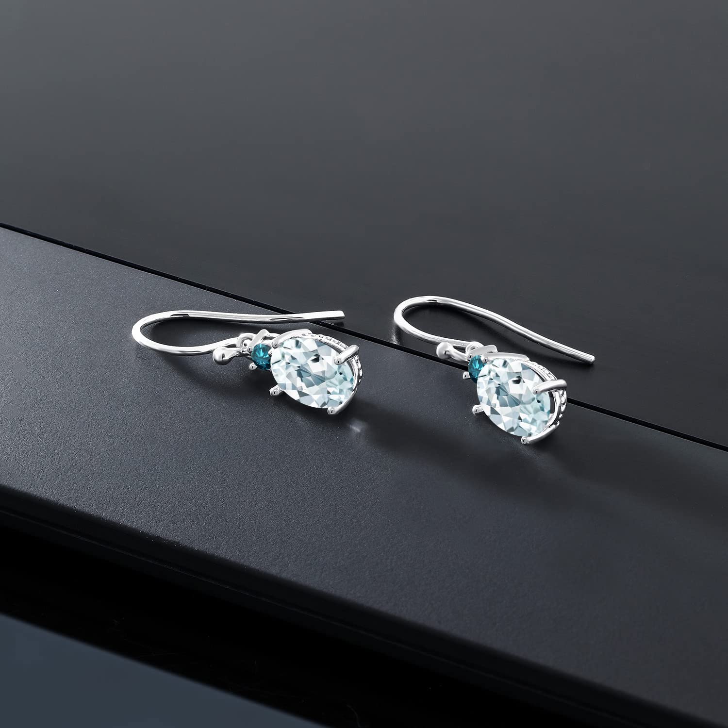 Gem Stone King 10K White Gold Sky Blue Aquamarine and Blue Diamond Dangle Earrings For Women (2.33 Cttw, Gemstone Birthstone, Oval 8x6mm)