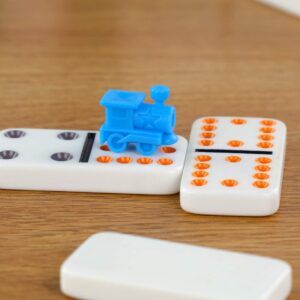 Regal Games â€“ Double 12 Dominoes â€“ Colored Dots Set â€“ Mexican Train Edition Set with, 91 Tiles, 4 Trains, Hub, & Collector's Tin - 2-8 Players Ages 8+ for Kids & Adults