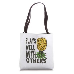 swinger couples plays well with others upside down pineapple tote bag