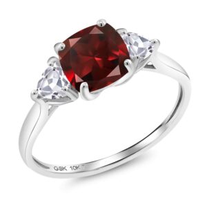 gem stone king 10k white gold red garnet and white created sapphire 3-stone engagement ring for women (2.49 cttw, 7mm cushion and 4mm trillion, available in size 5, 6, 7, 8, 9)