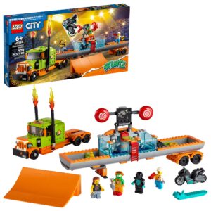 lego city stunt show truck 60294 building toy set with launch ramps and a dunk tank plus a flywheel-powered stunt bike