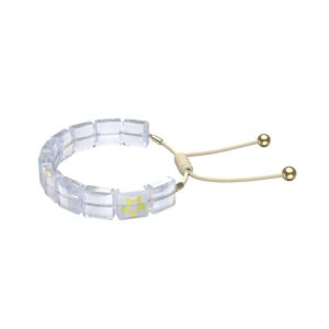 swarovski letra soft bracelet with white square-cut crystals and printed star motif, on adjustable waxed cotton cord, part of the letra collection