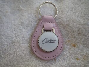 1960's 1970's era cutlass emblem logo leather keychain - pink