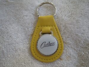 1960's 1970's era cutlass emblem logo leather keychain - yellow