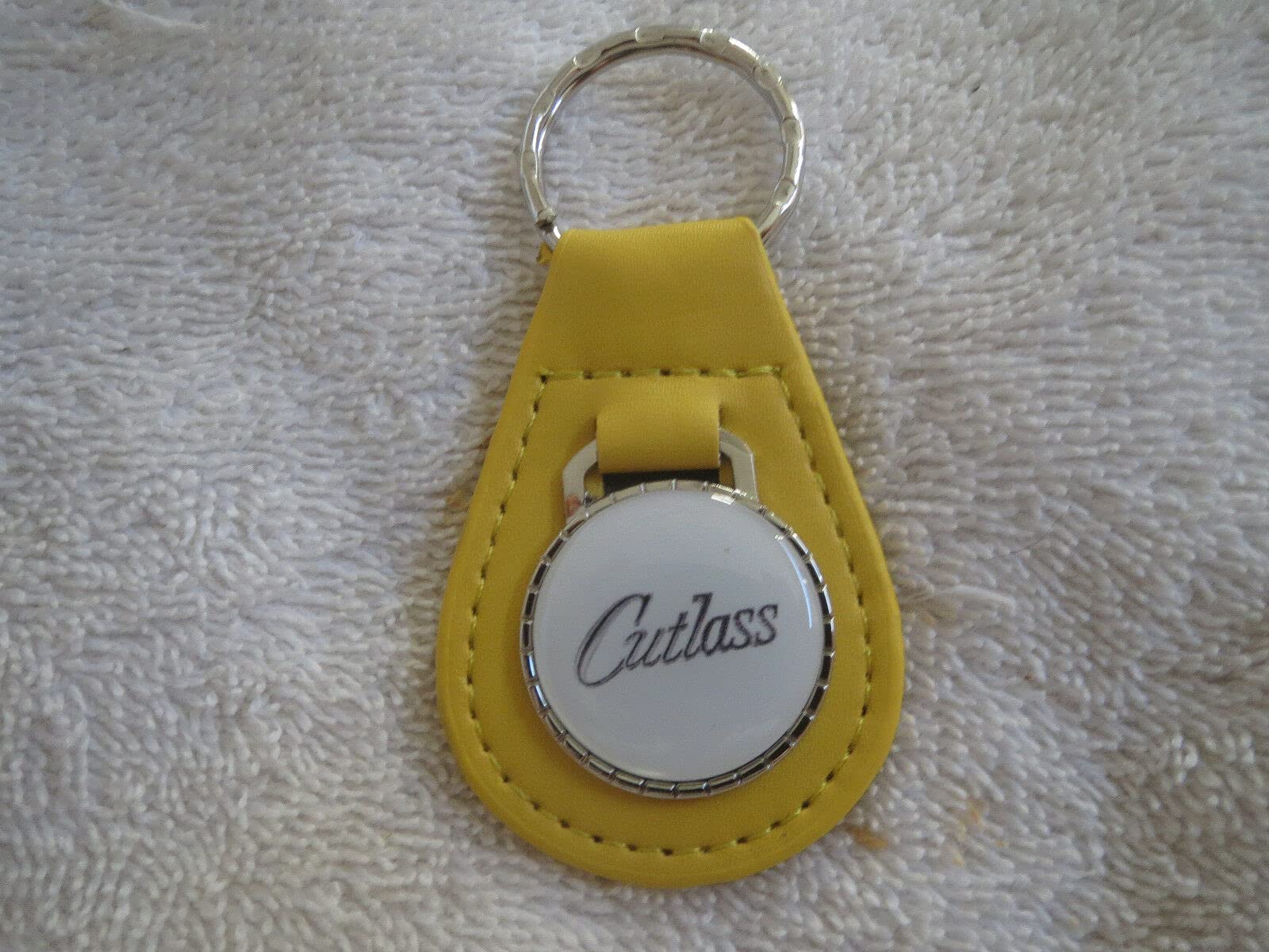 1960's 1970's ERA CUTLASS EMBLEM LOGO LEATHER KEYCHAIN - YELLOW