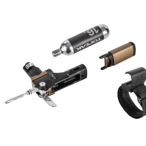 Topeak Tubi Master+, compact tubeless tire repair kit with 3.5mm plug tool, plugs, CO2 inflator, one 16g CO2 cartridge, and knife, strap mount