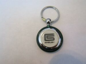 shelby cobra early cs logo round plastic keychain - green