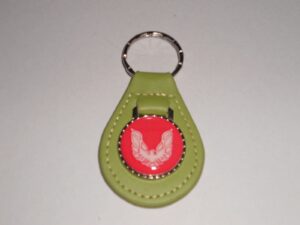 firebird or trans-am white bird logo leather keychain - lime green