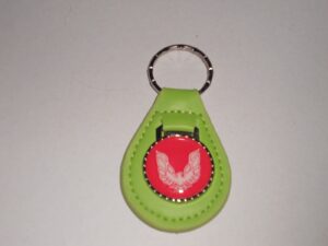 firebird or trans-am white bird logo leather keychain - bright green