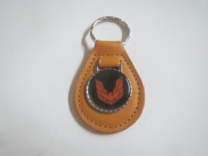 firebird or trans-am orange bird logo leather keychain - orange