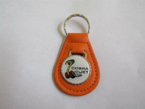 cobra jet snake on wheels performance logo leather keychain - pumpkin