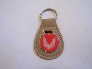 firebird or trans-am white bird logo leather keychain - beige