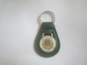 1962 1963 1964 galaxie 406 high performance engine logo leather keychain - teal