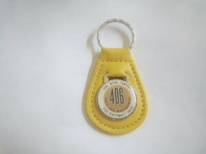 1962 1963 1964 galaxie 406 high performance engine logo leather keychain - yellow