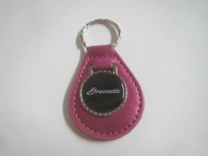 1975 1976 1977 1978 1979 1980 1981 1982 granada script logo leather keychain - magenta