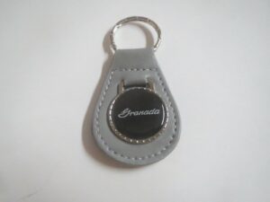 1975 1976 1977 1978 1979 1980 1981 1982 granada script logo leather keychain - grey